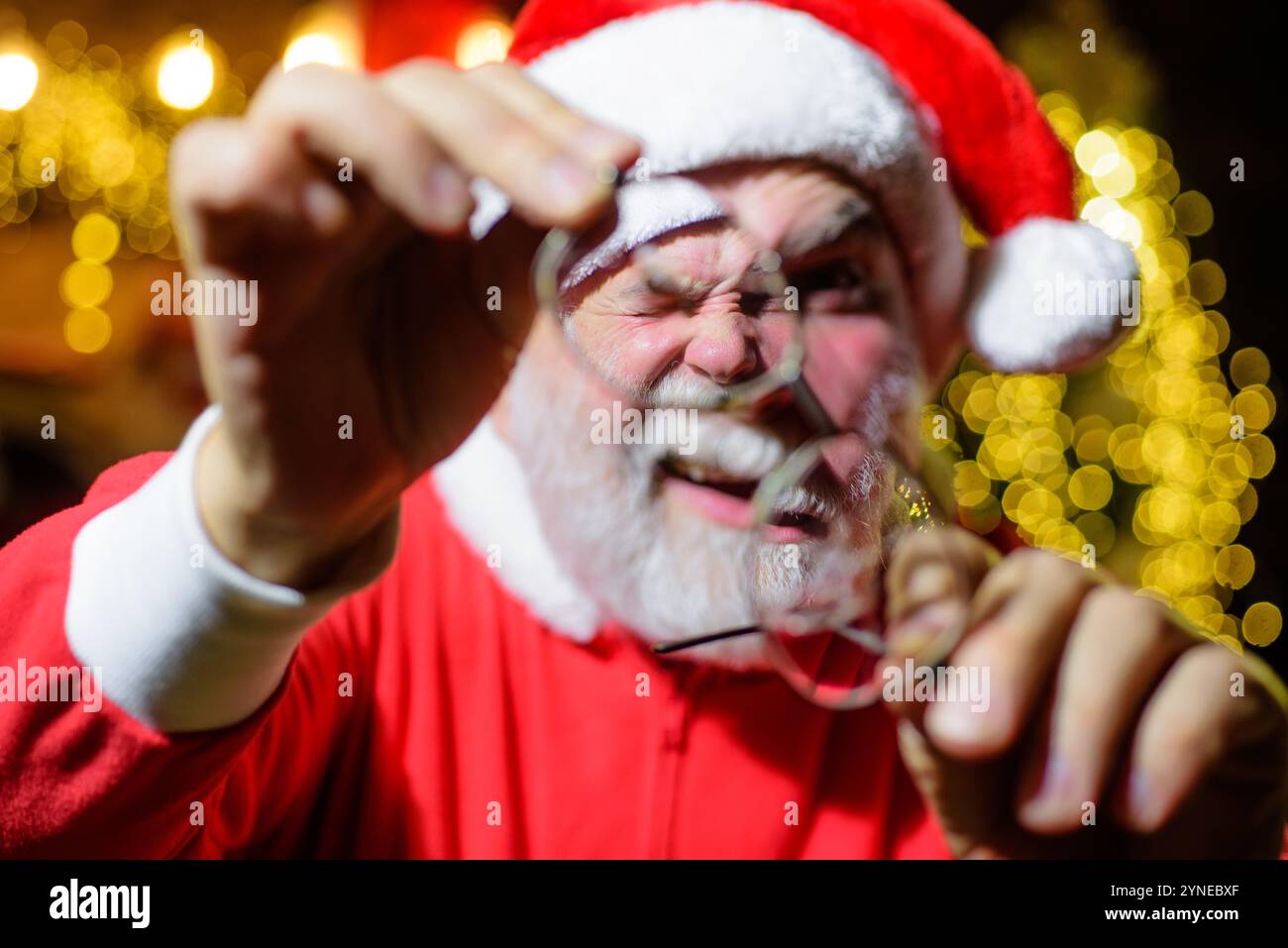 Santa Claus with broken glasses. Selective focus. Christmas time ...