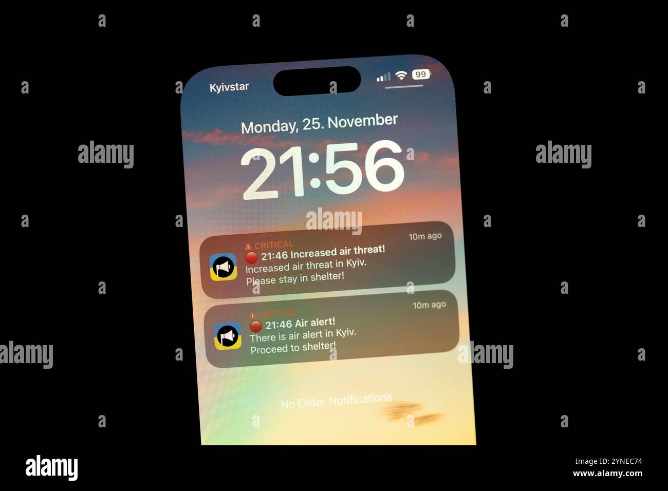 Person seen holding smartphone in hand displaying an air alert ...