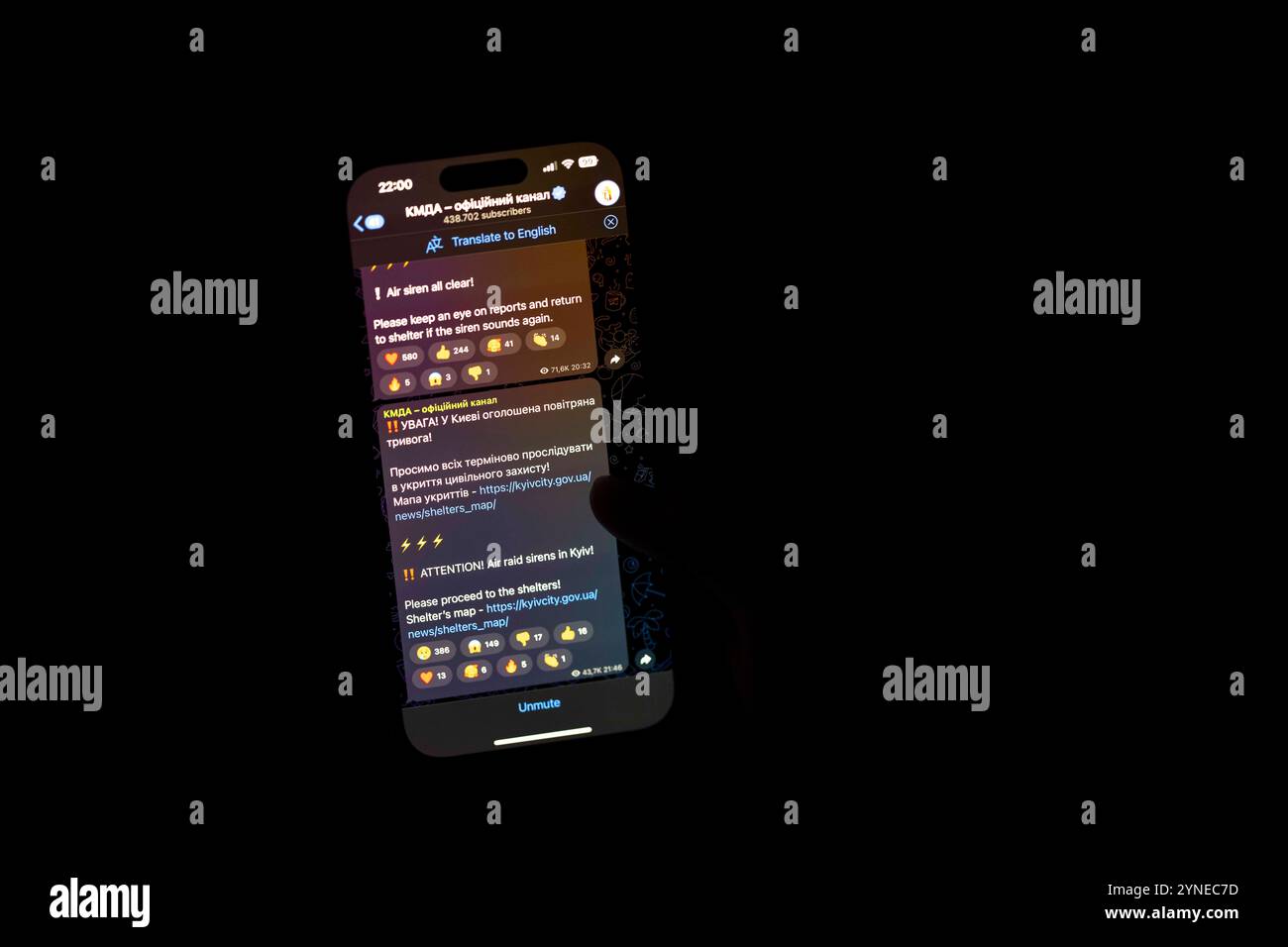 Person seen holding smartphone in hand displaying an air alert ...