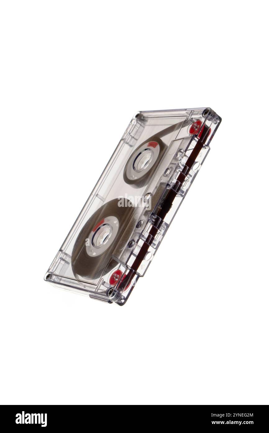 Clear plastic audio cassette tape with visible reels and magnetic tape ...