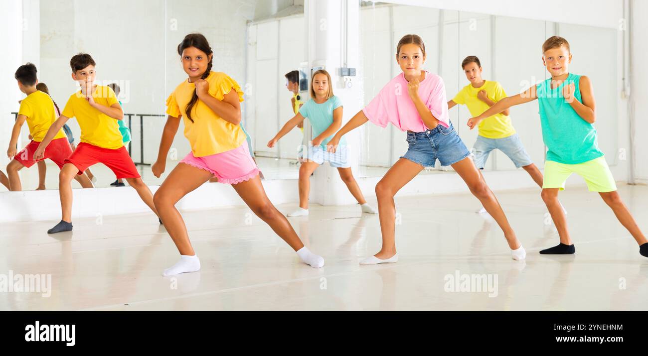 Group of kids training modern dance moves Stock Photo - Alamy