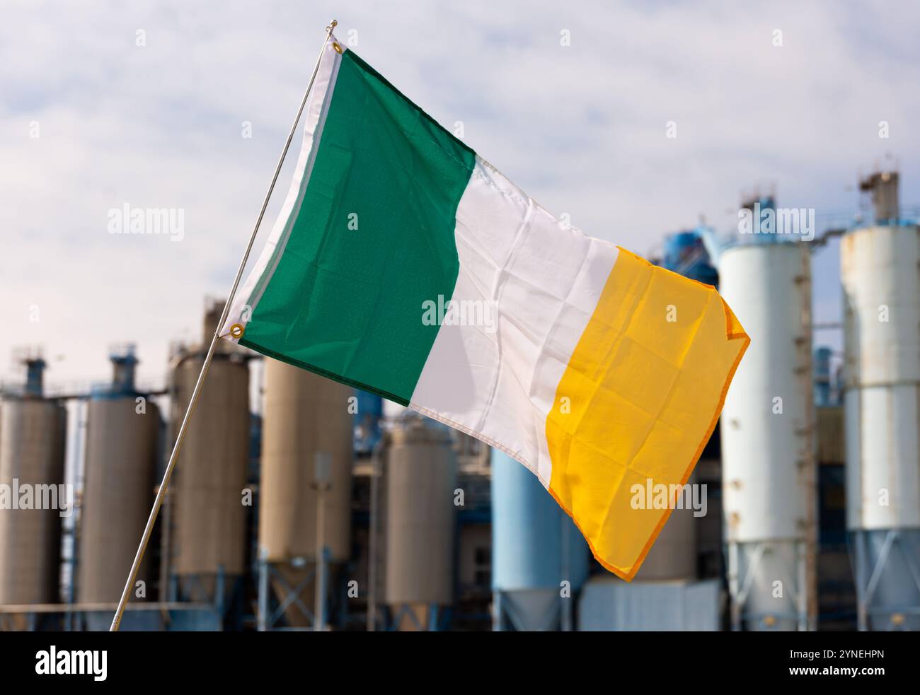 Flag of ireland flying with pride in front of industrial scenery Stock ...