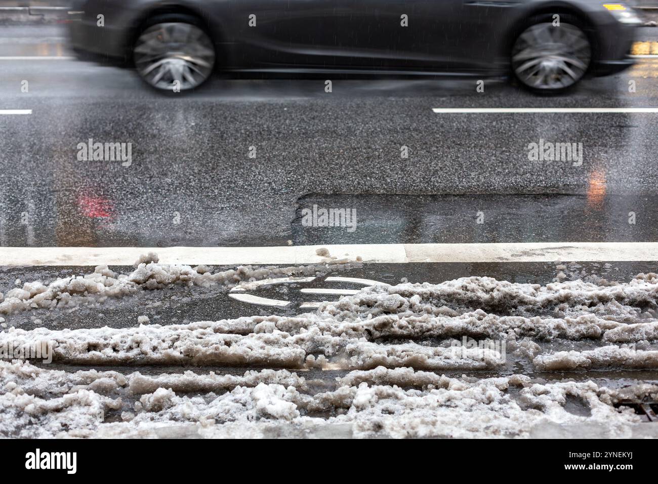 Snow slush on the cycle lane on a main road in Hamburg Stock Photo - Alamy