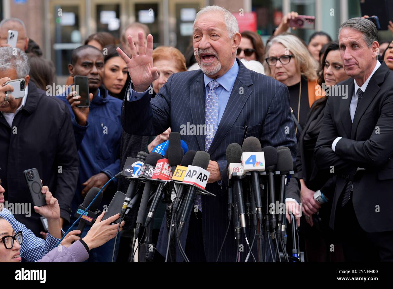 Attorneys Mark Geragos, center, and Bryan Freedman, right, hold a news ...