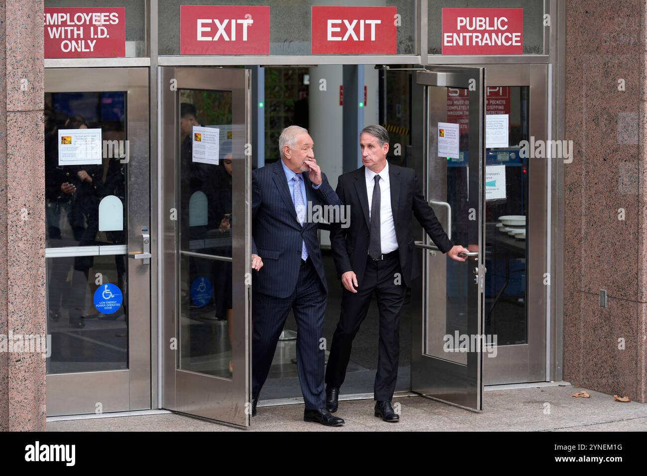 Attorneys Mark Geragos, left, and Bryan Freedman, leave the Van Nuys ...
