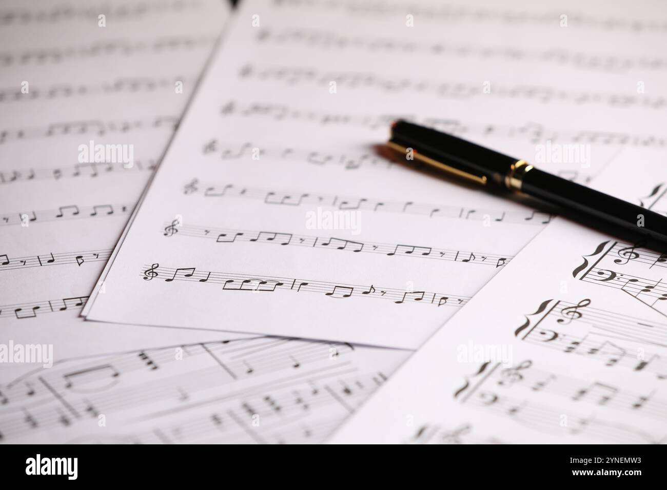 Sheets of musical notes and pen as background, closeup Stock Photo - Alamy