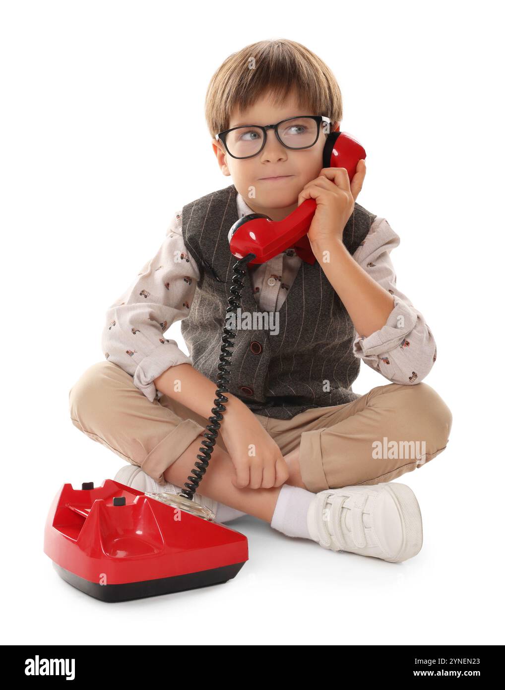 Cute little boy with old telephone on white background Stock Photo - Alamy