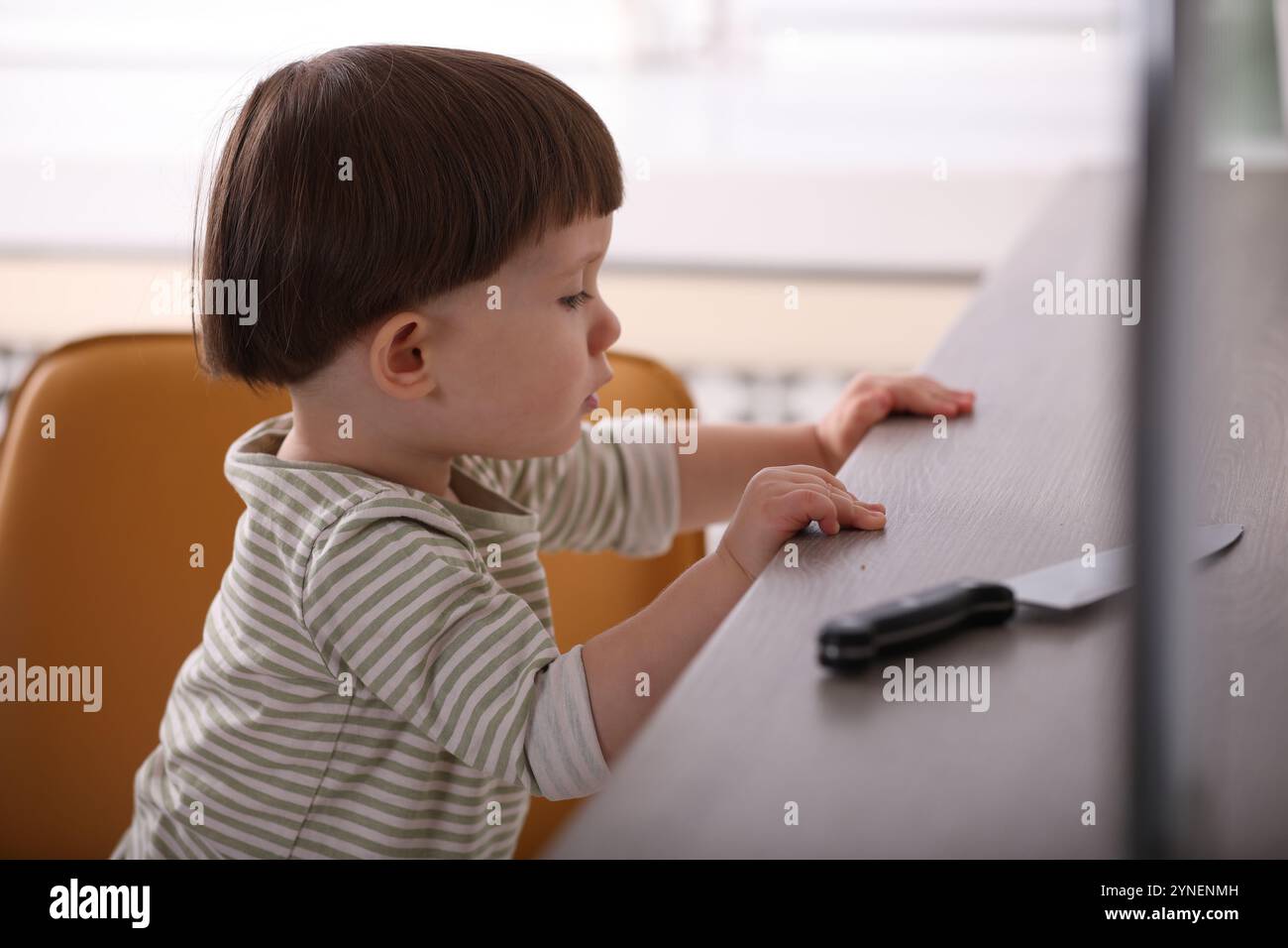 Toddler boy child reaching dangerous hi-res stock photography and ...