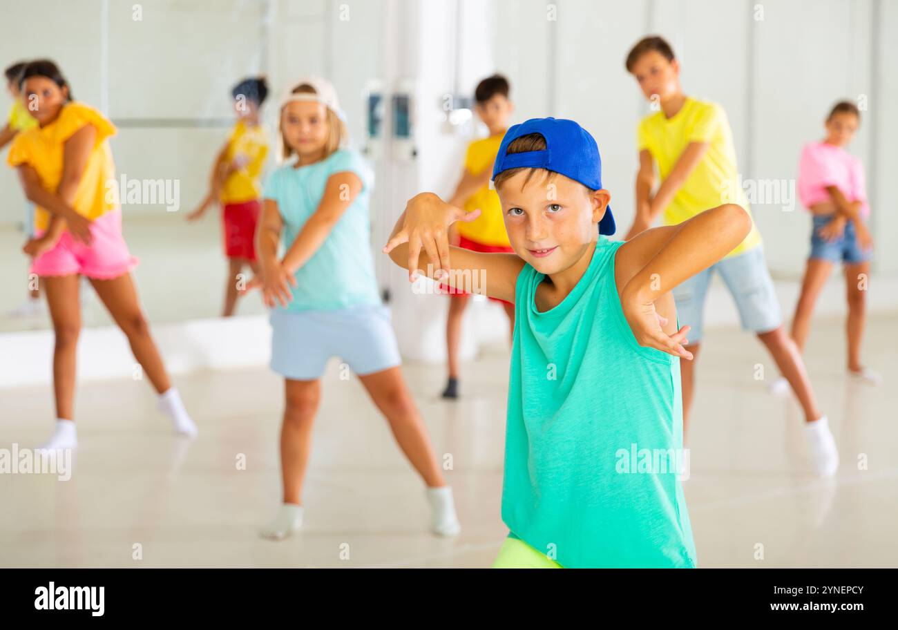 Boy and other kids dancing hip hop in studio Stock Photo - Alamy