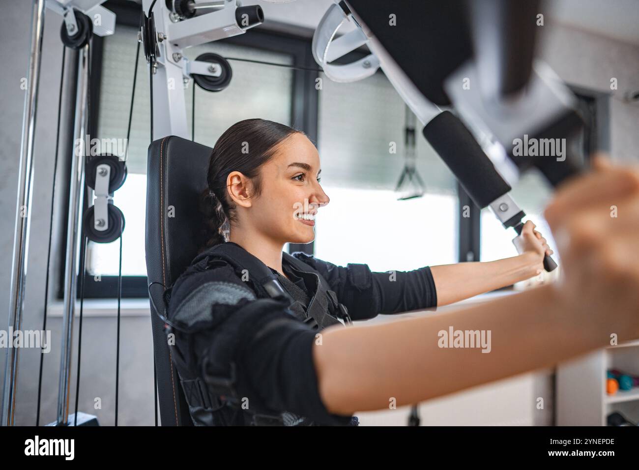 Try cutting edge fitness with muscle stimulation Stock Photo - Alamy