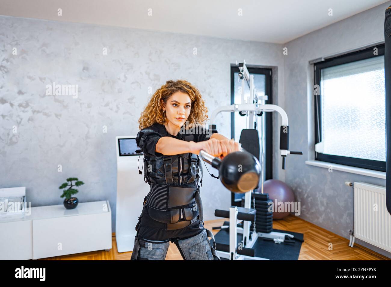 High-tech gym workout with muscle stimulation Stock Photo - Alamy