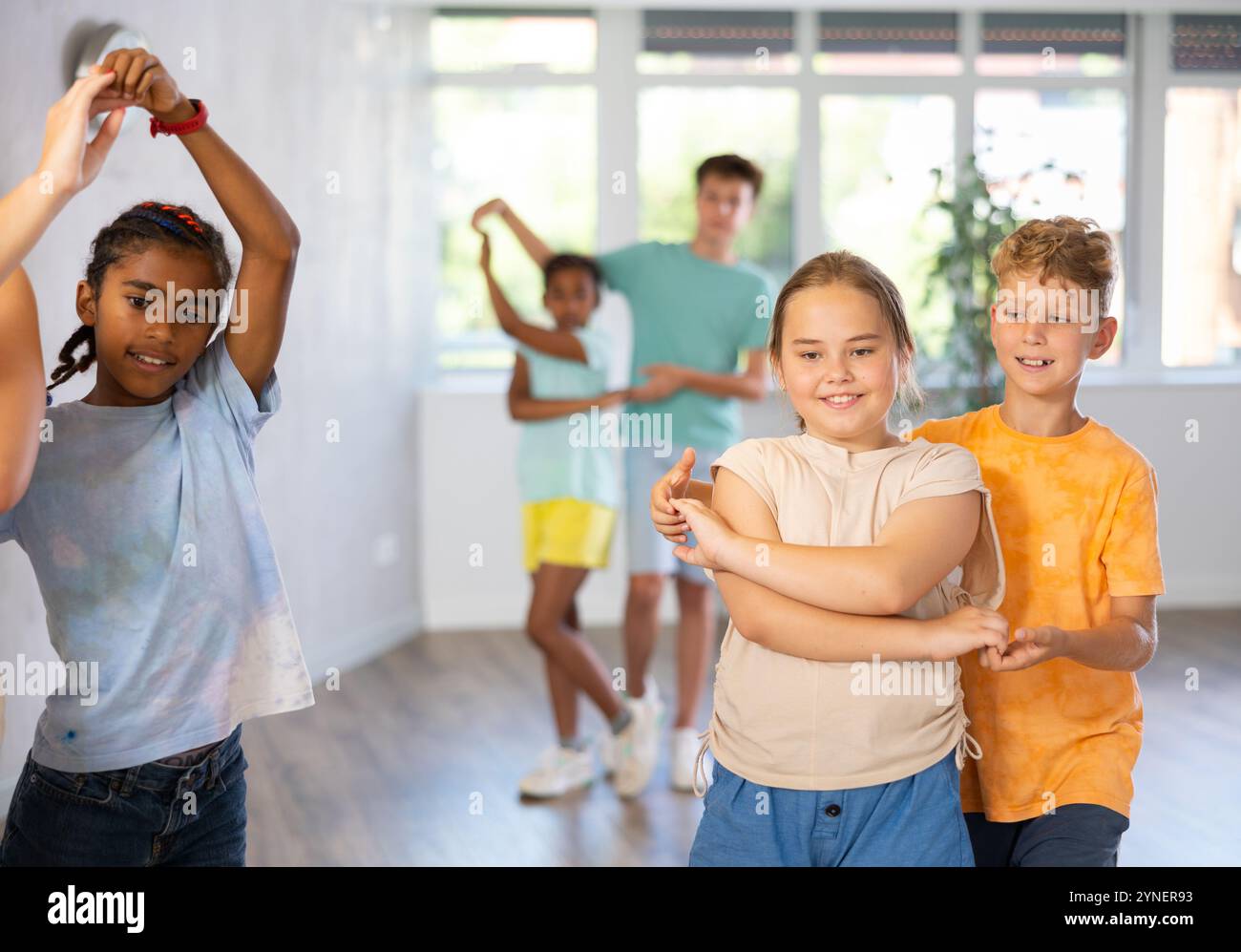 Tween boy and girl dancing slow ballroom dances in pair Stock Photo - Alamy