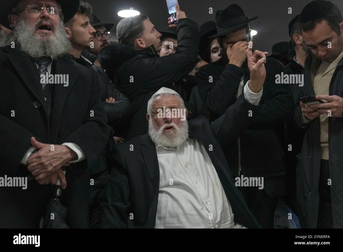 Ultra-Orthodox Jews attend the funeral of Israeli-Moldovan rabbi Zvi ...