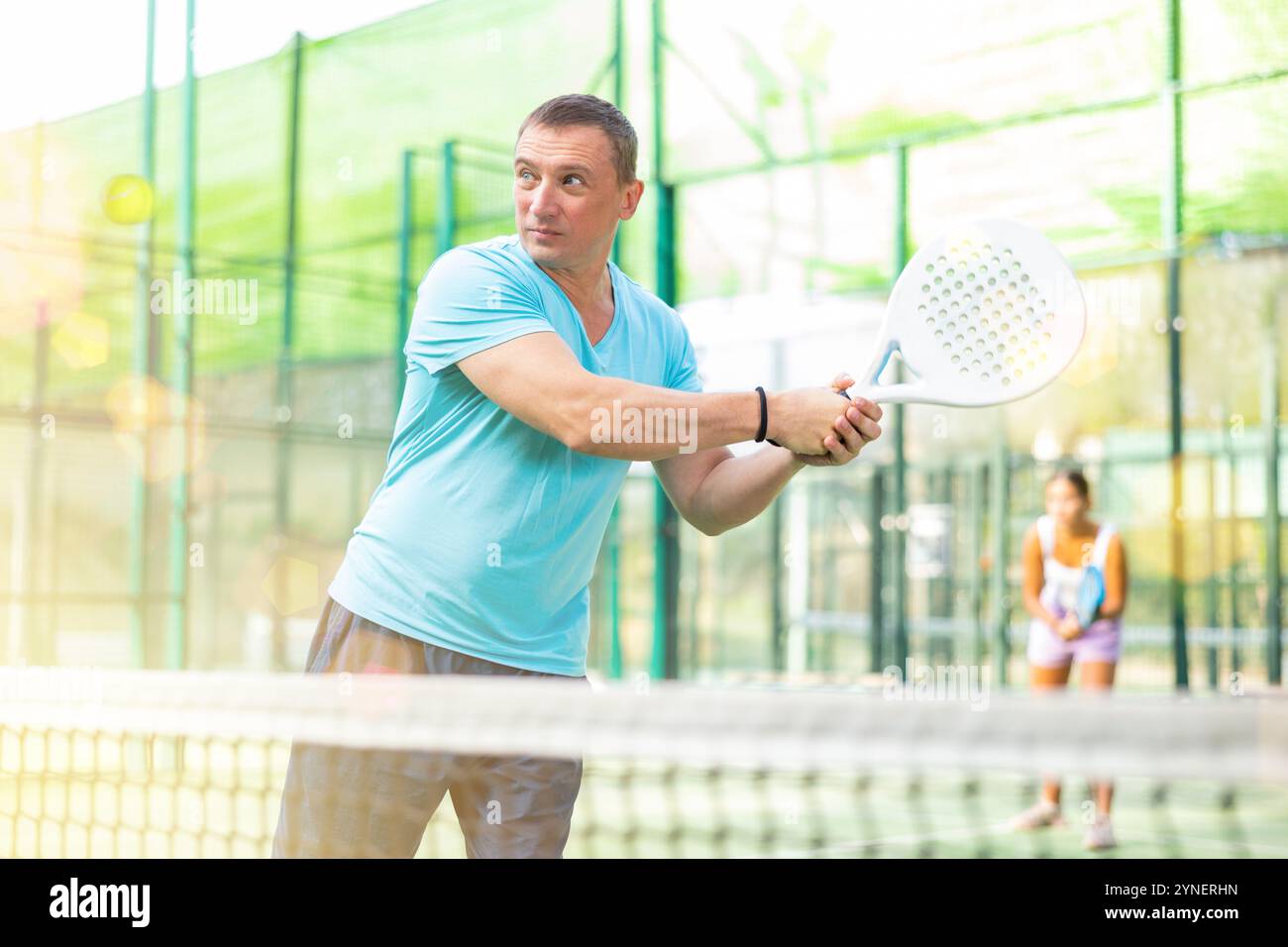 Male padel tennis player training on court Stock Photo - Alamy