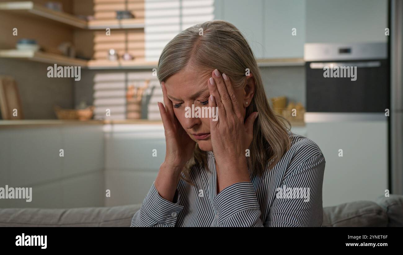 Unhealthy mature elderly upset tired Caucasian woman grandmother ...