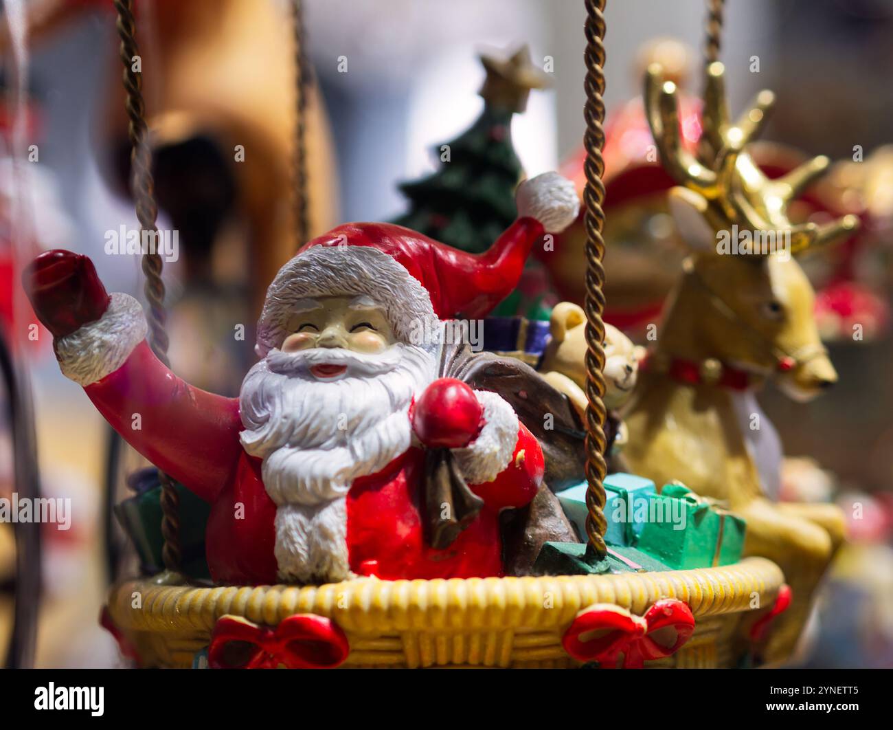 Miniature Christmas scene close-up with Santa Claus figurine waving ...