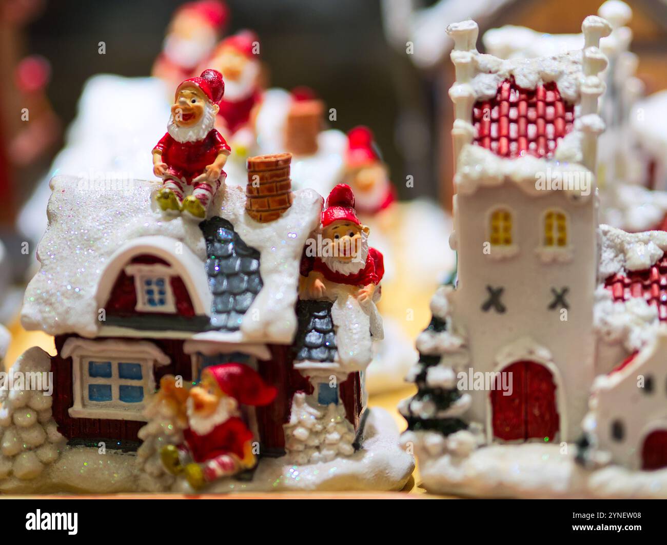 Miniature Christmas scene close-up with Santa goblin figurines and ...