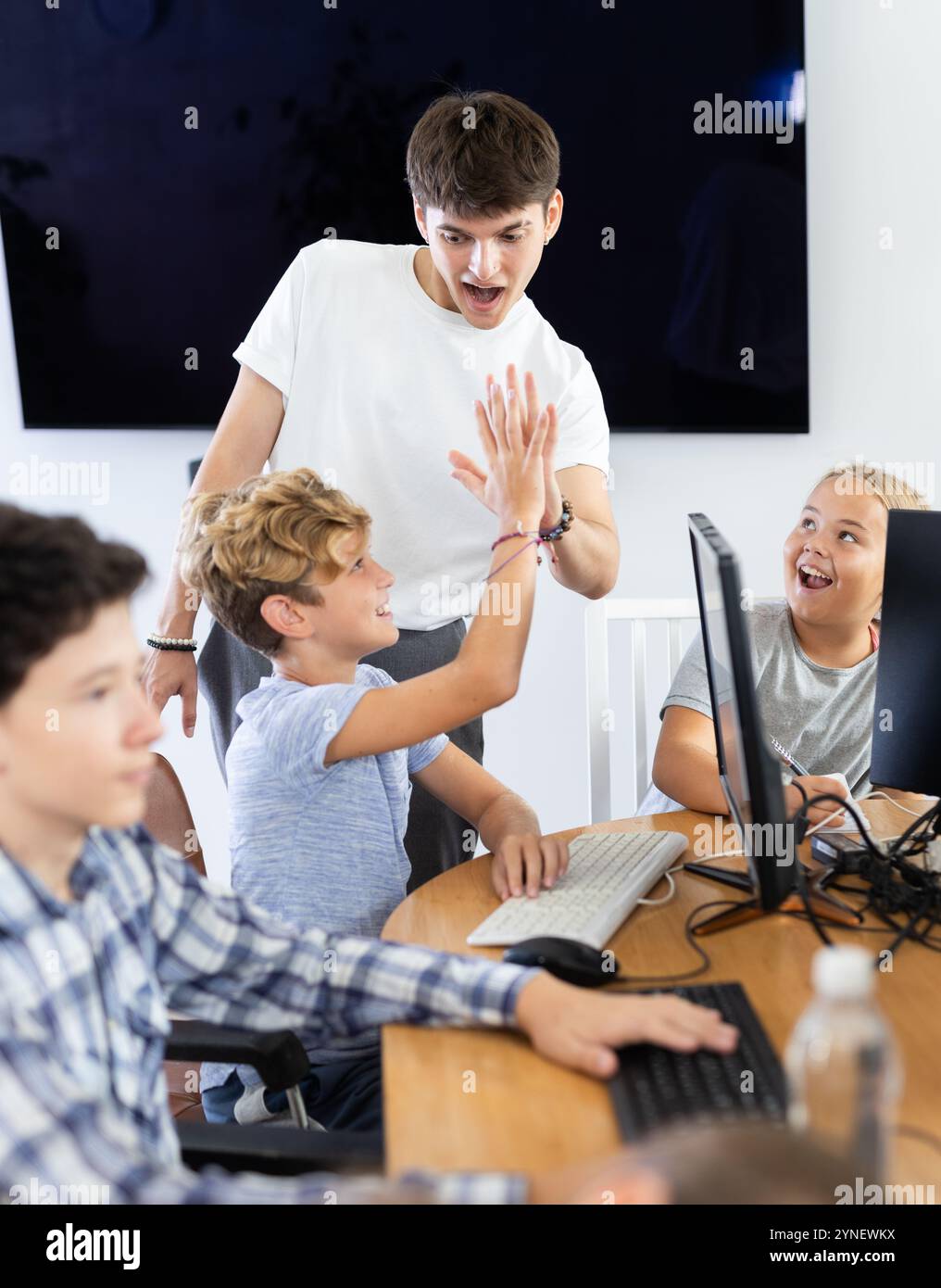 Computer lesson in classroom - successful student solved a computer ...