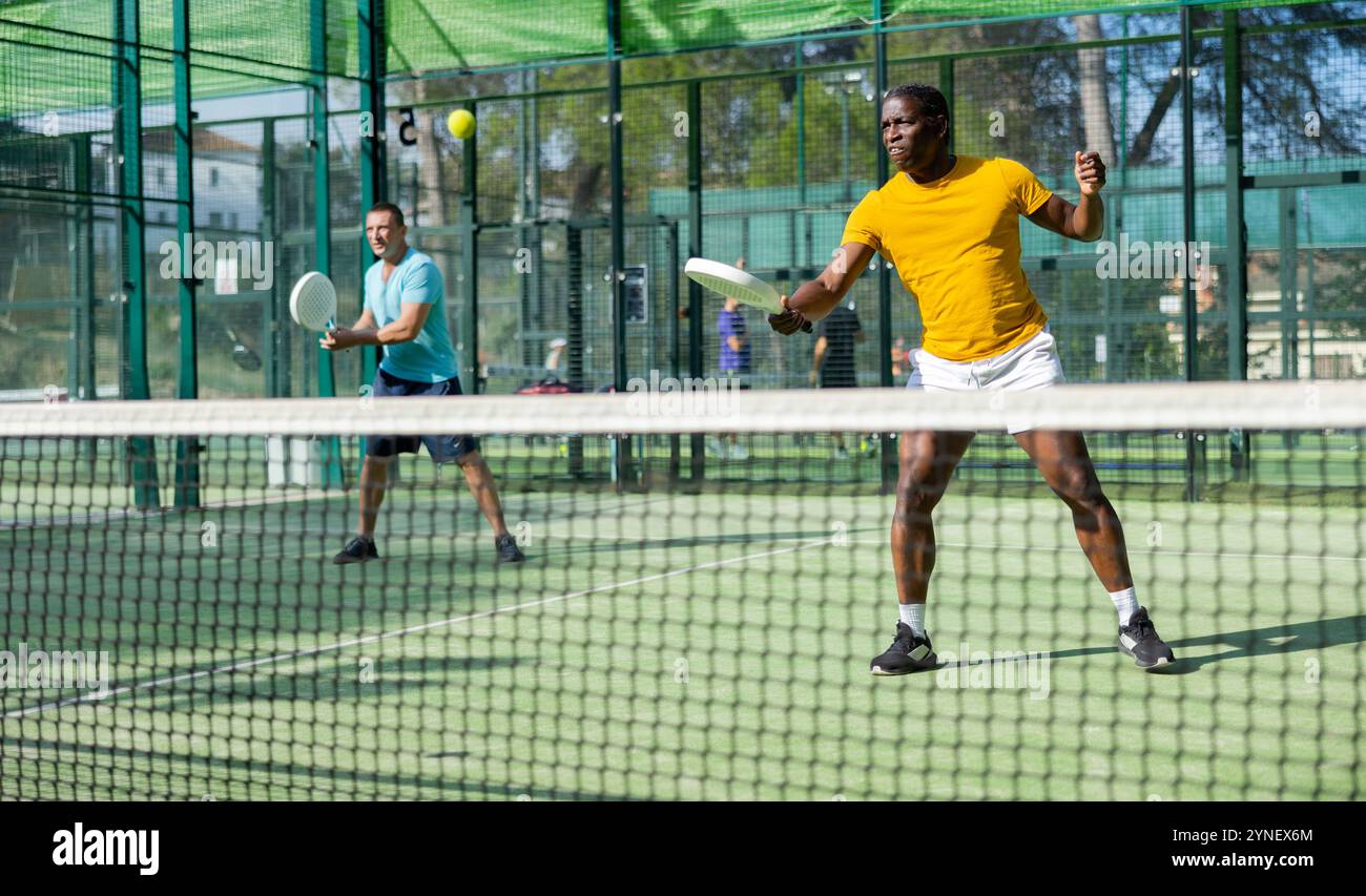 African american man padel tennis player trains on the court Stock ...