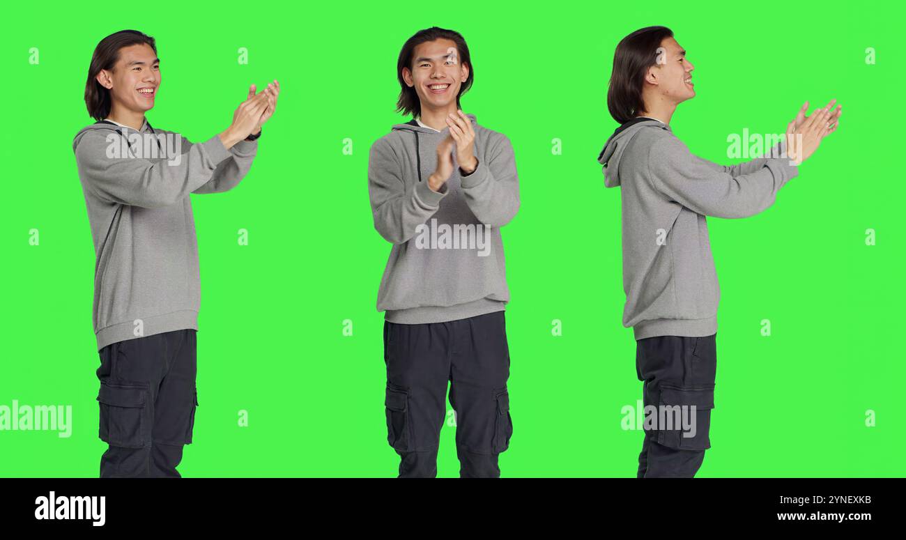 Asian cheerful man applauding someone, clapping hands to show his ...