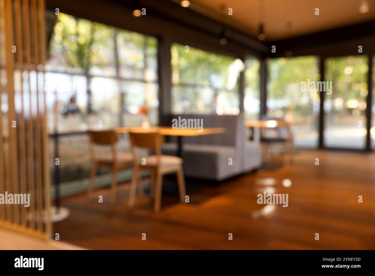 Blurred view of stylish cafe with large windows Stock Photo - Alamy