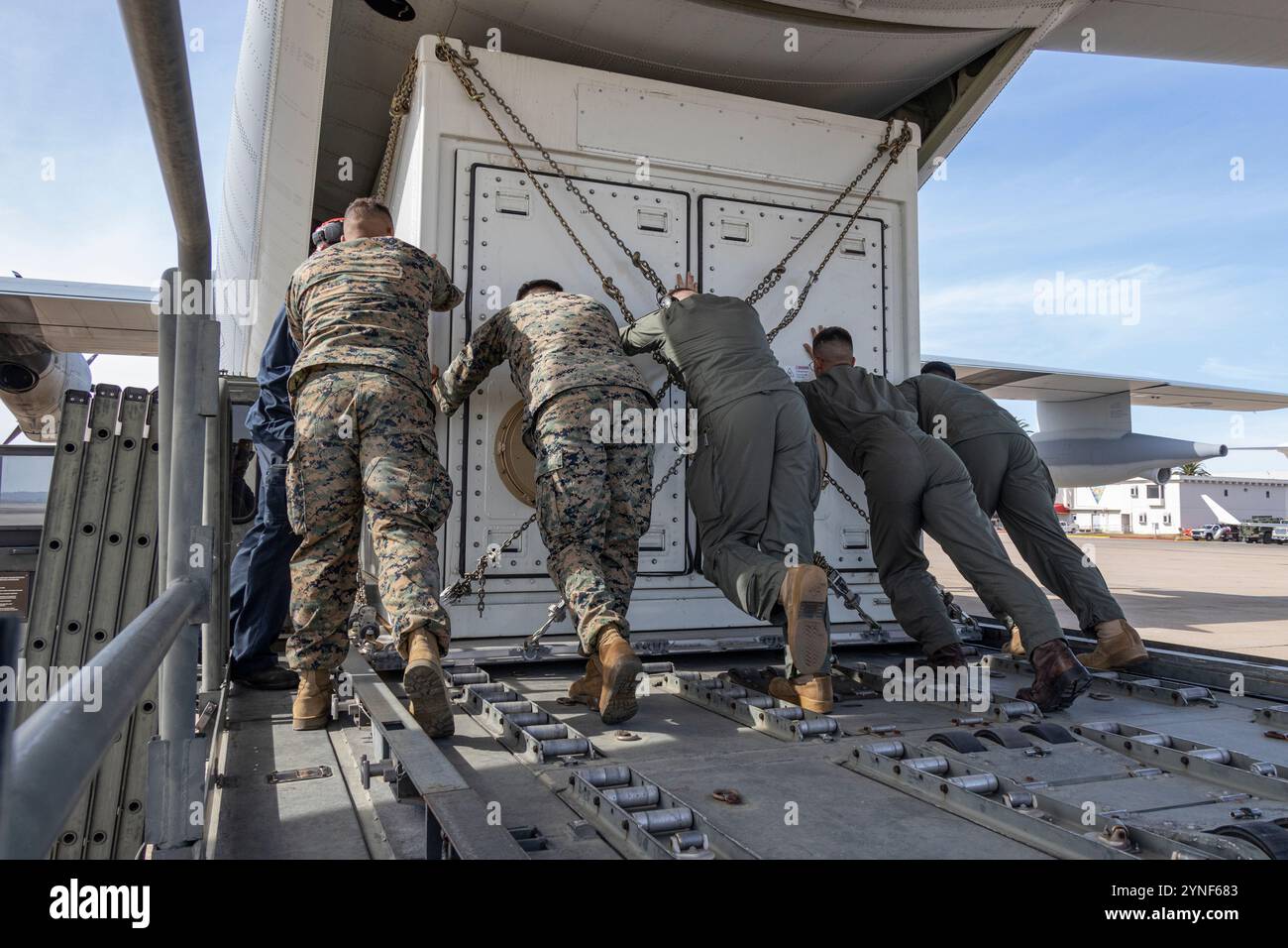 U.S. Marines with 3rd and 1st Marine Aircraft Wings load a Deployable ...