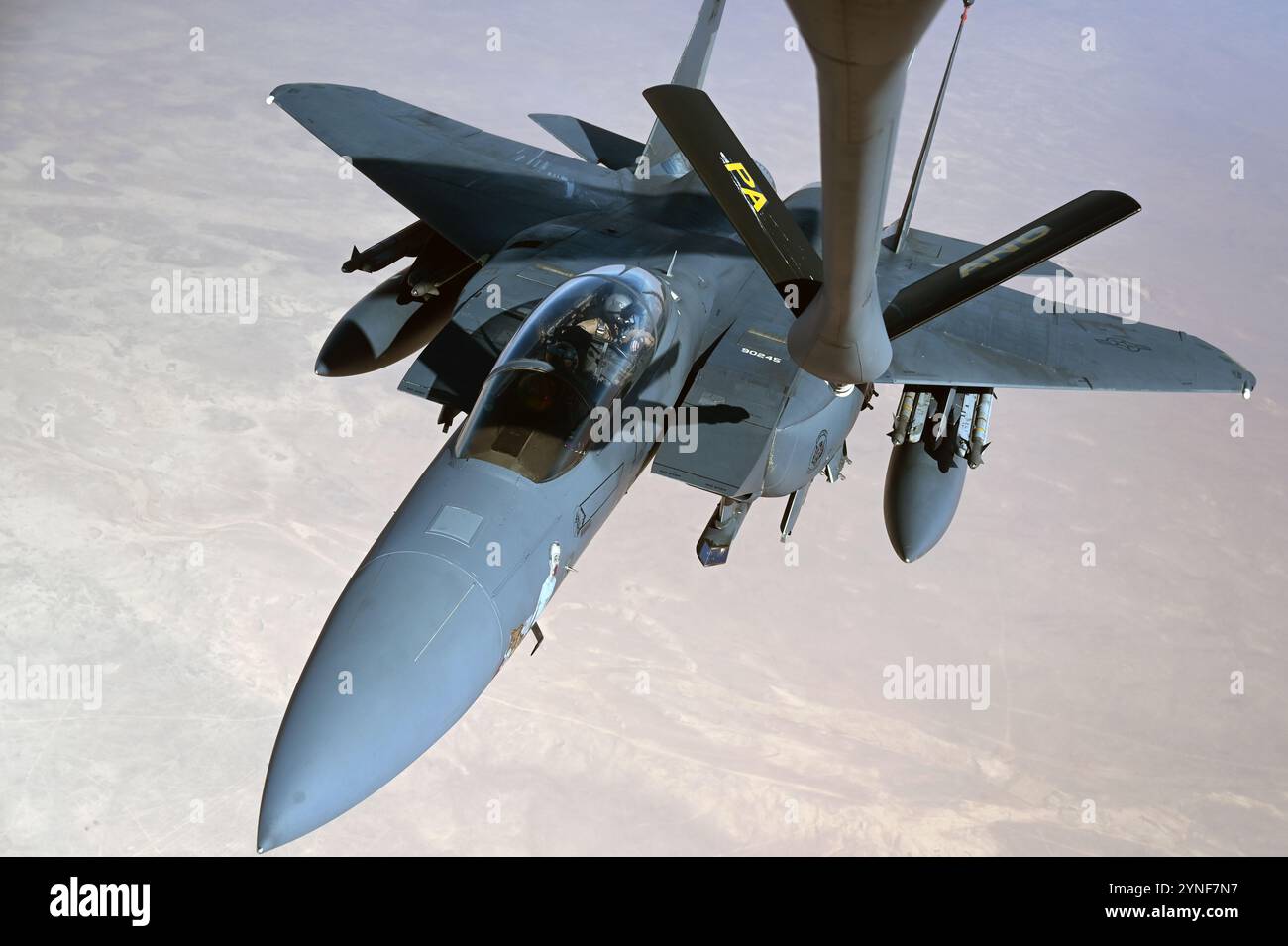 A U.S. Air Force F-15E Strike Eagle prepares to receive fuel from a KC ...