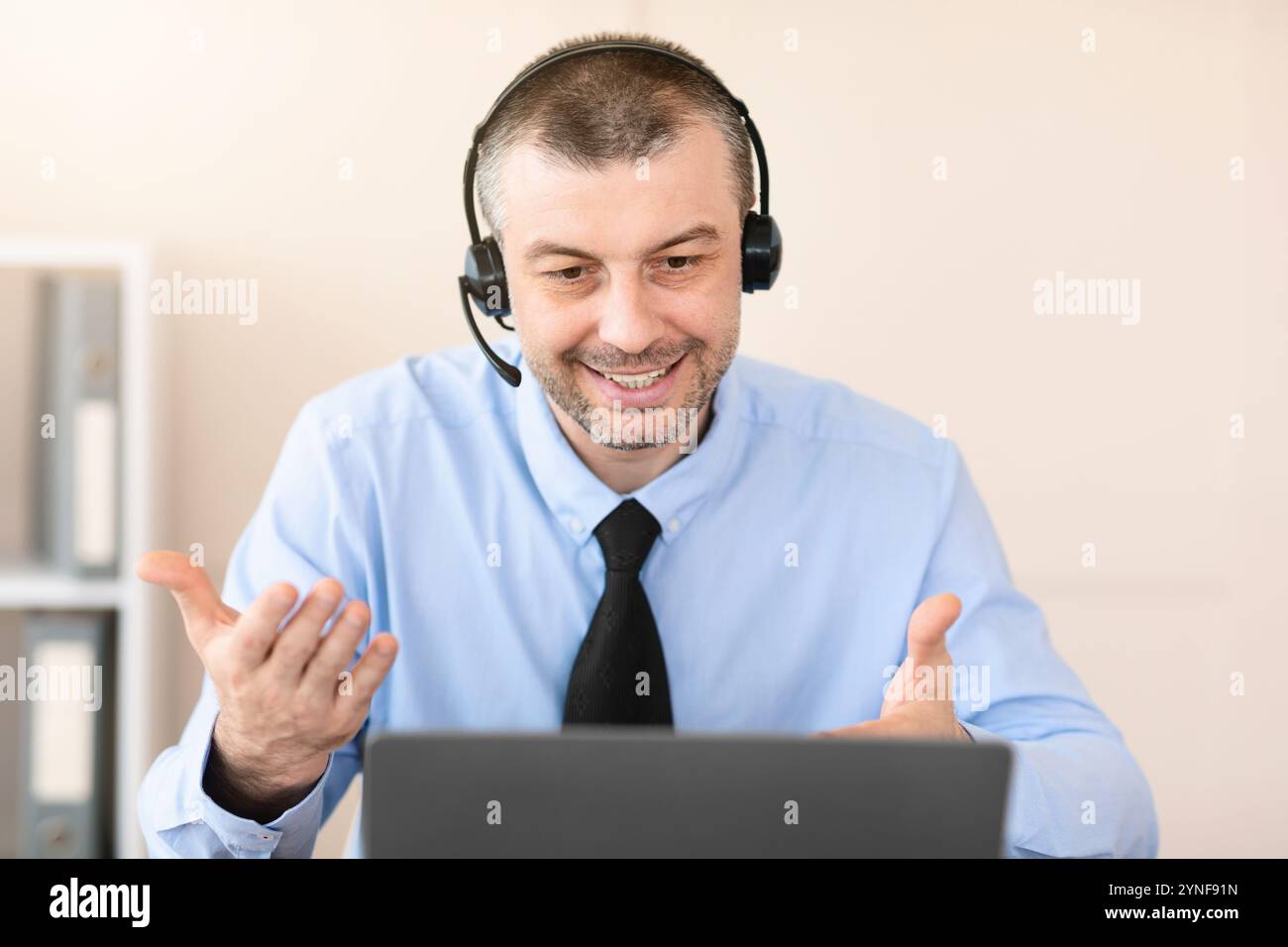 Hotline Operator Talking With Client Making Video Call In Office Stock ...