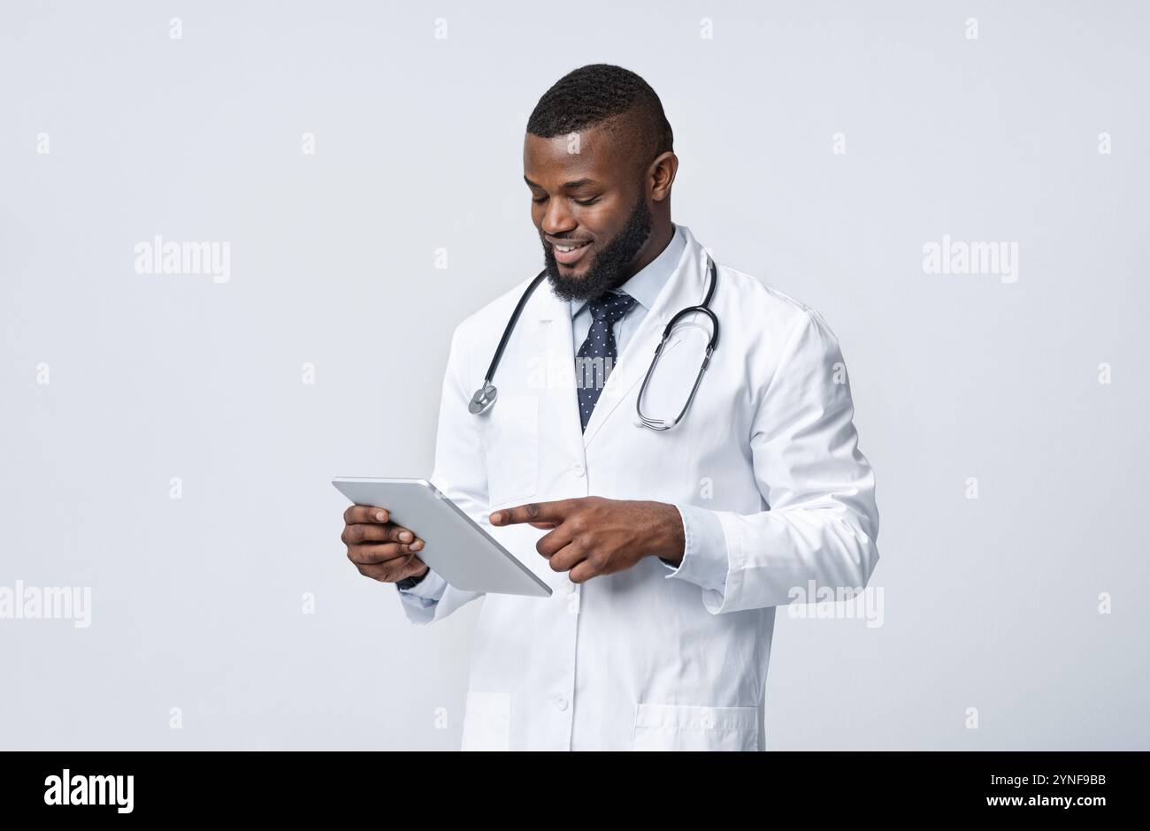 African physician using modern device hi-res stock photography and ...