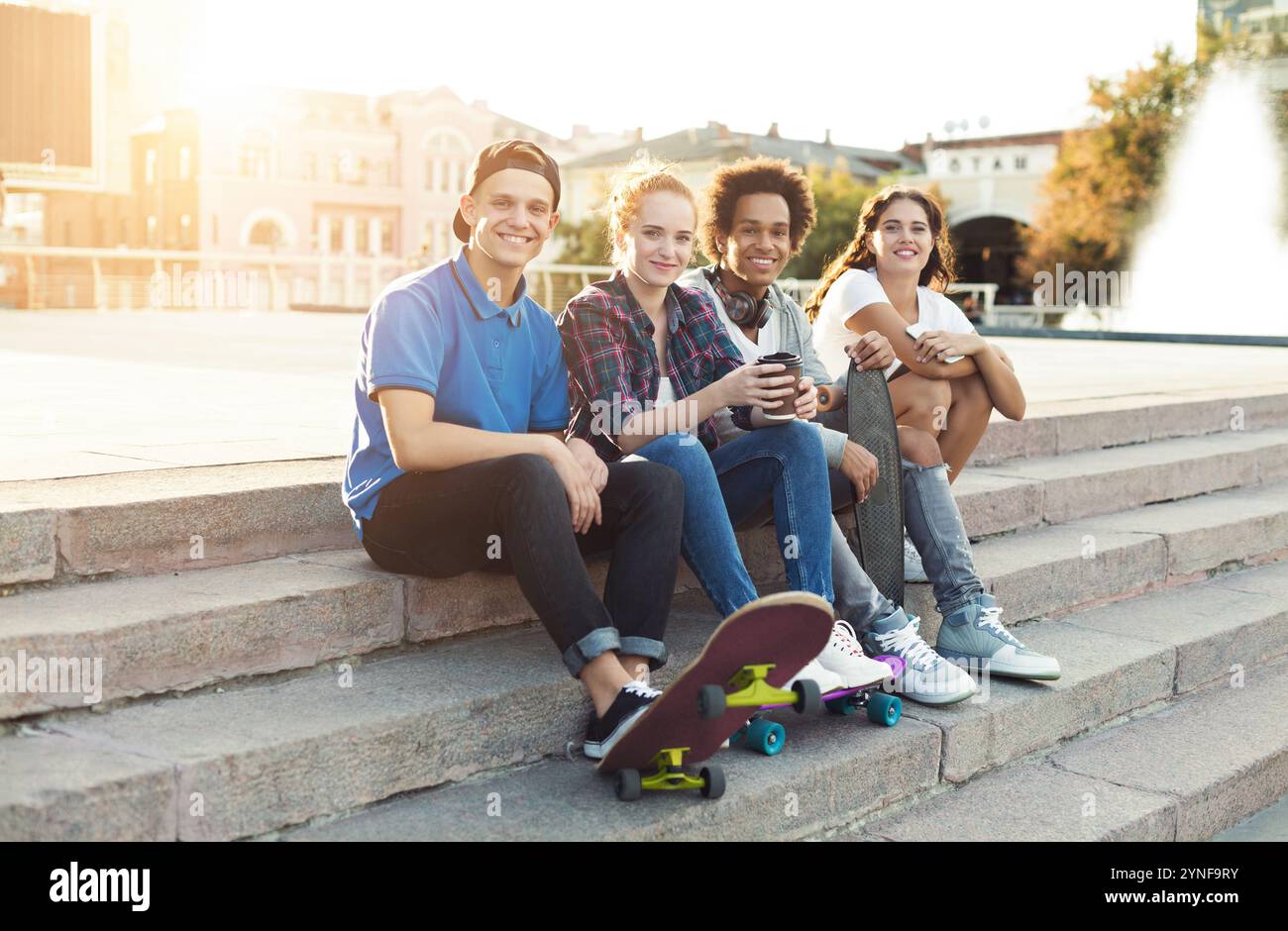 Diverse group teenage friends sitting hi-res stock photography and ...