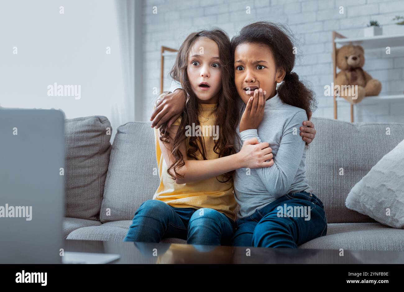 Diverse kids watching tv hi-res stock photography and images - Alamy