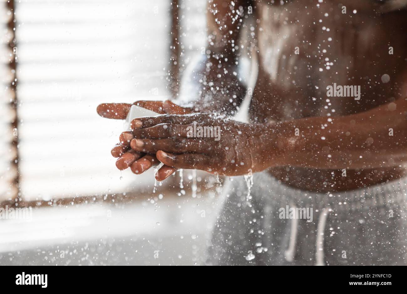 African hands with water drops hi-res stock photography and images - Alamy