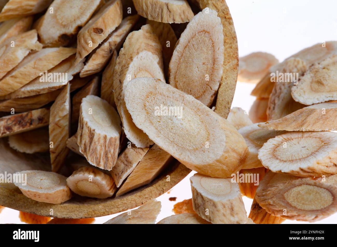 Chinese herbal medicine astragalus membranaceus on a white background ...