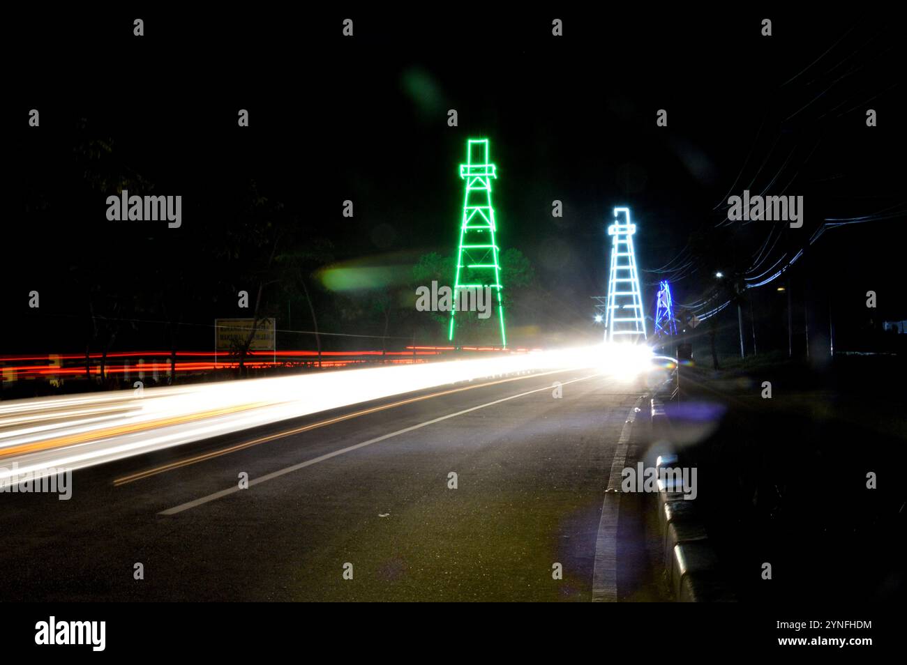 the atmosphere of the night on Tarakan City with old oil tower ...