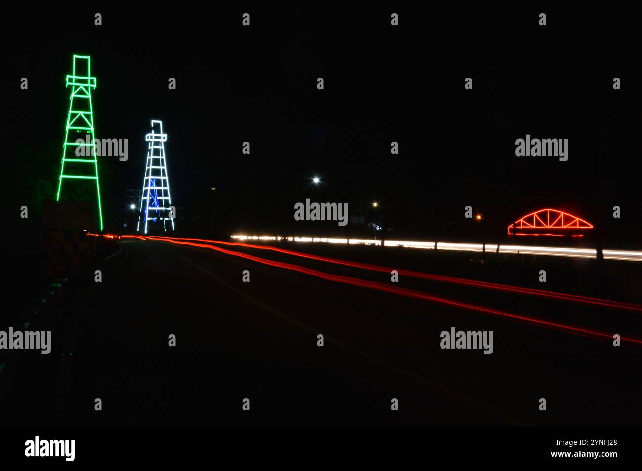 the atmosphere of the night on Tarakan City with old oil tower ...