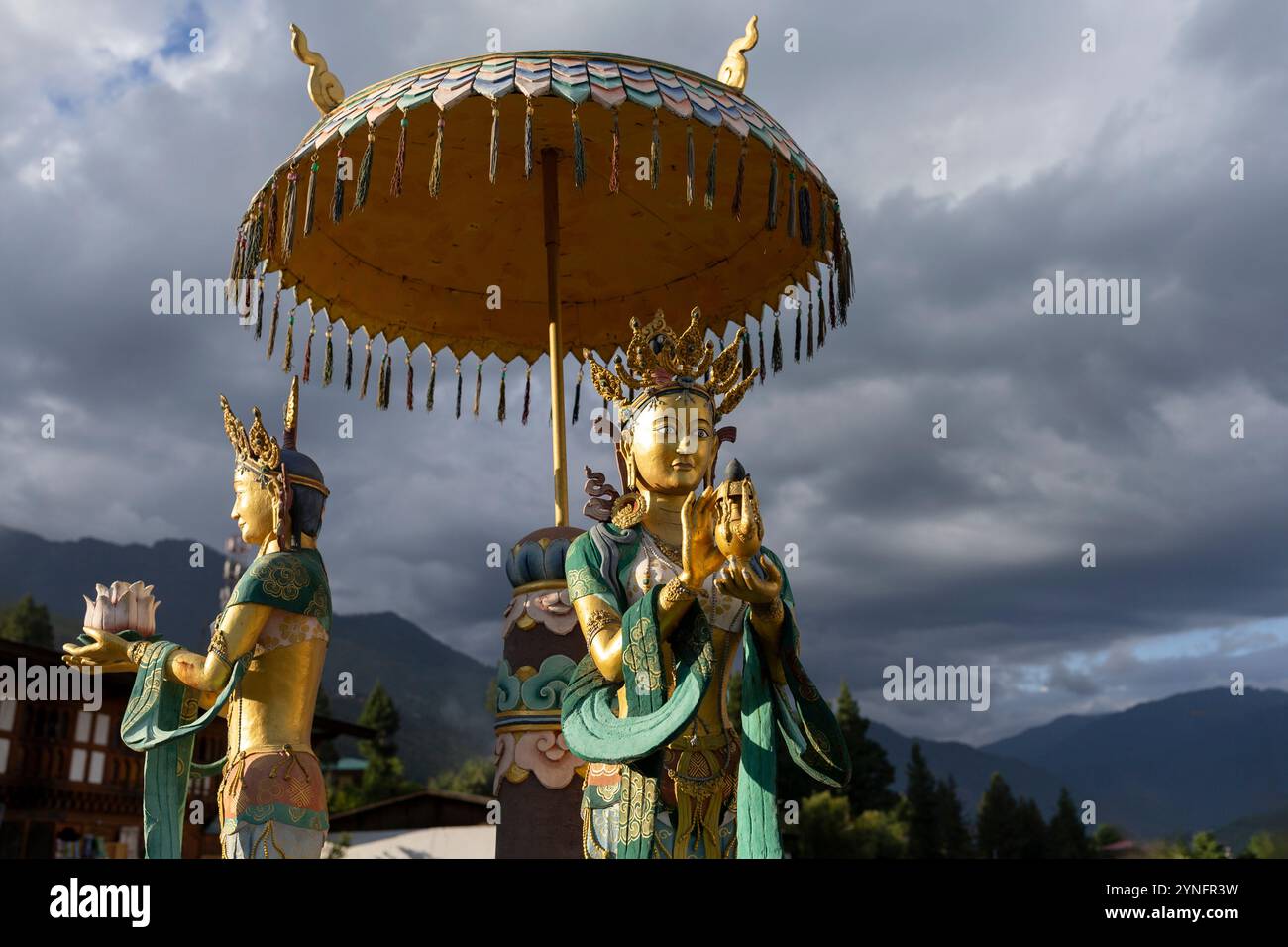 Golden female god statues at the roundabout in Thimphu, Bhutan Stock ...