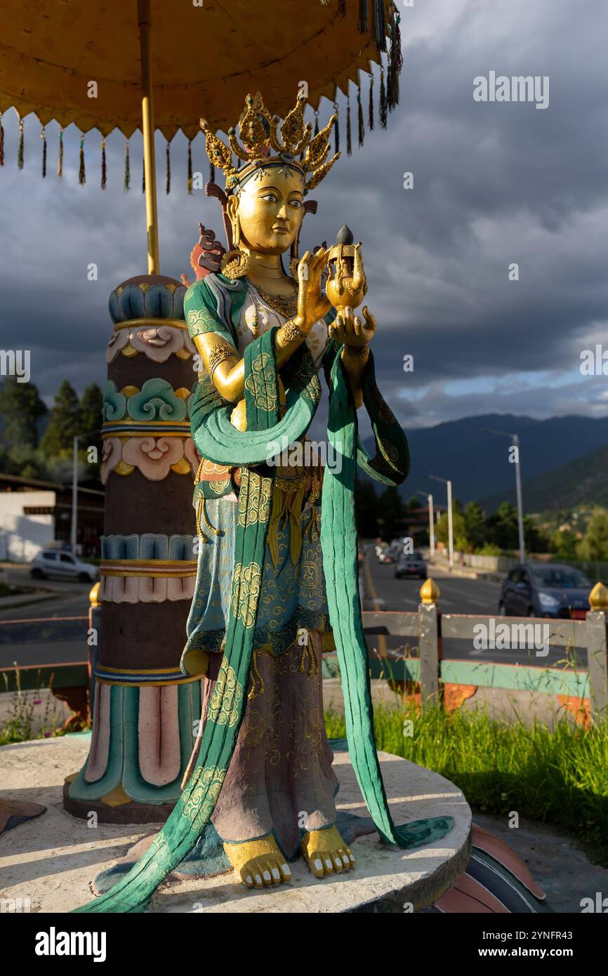 Golden female god statues at the roundabout in Thimphu, Bhutan Stock ...