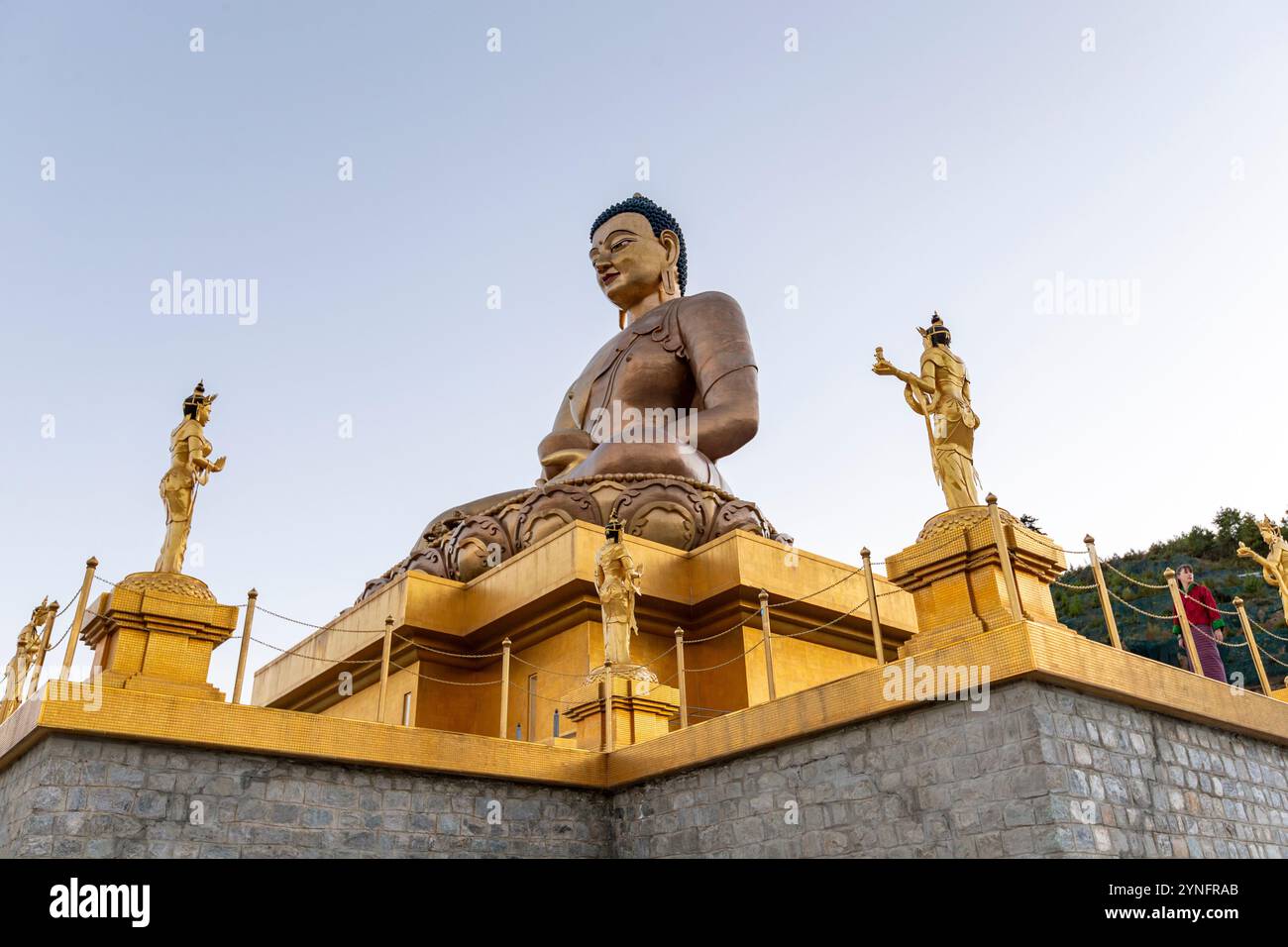 Buddha Dordenma, a large golden buddha statue sitting on the top of a ...