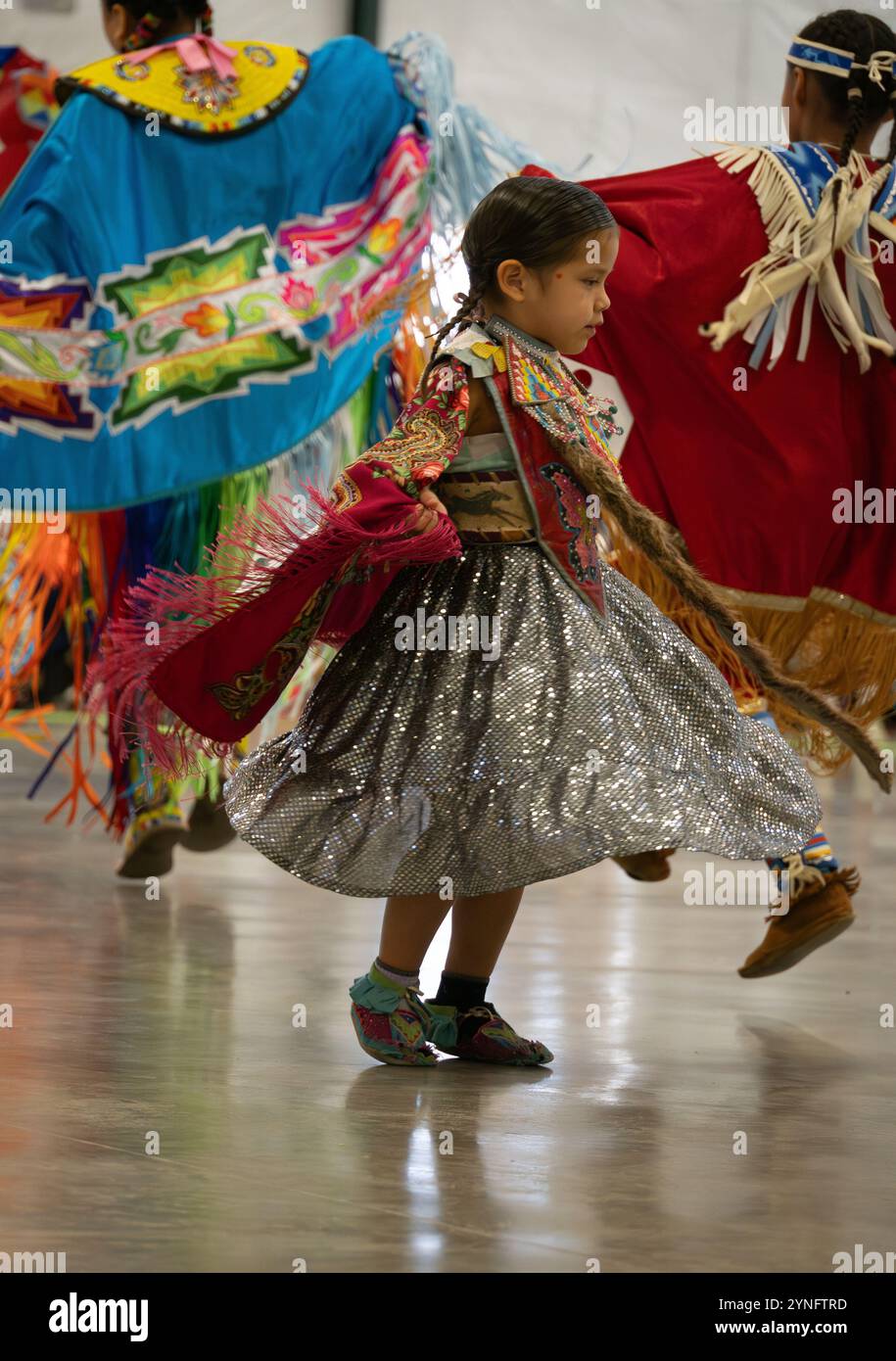 Little Native American girl dancing in a fancy shawl dance at the Last ...