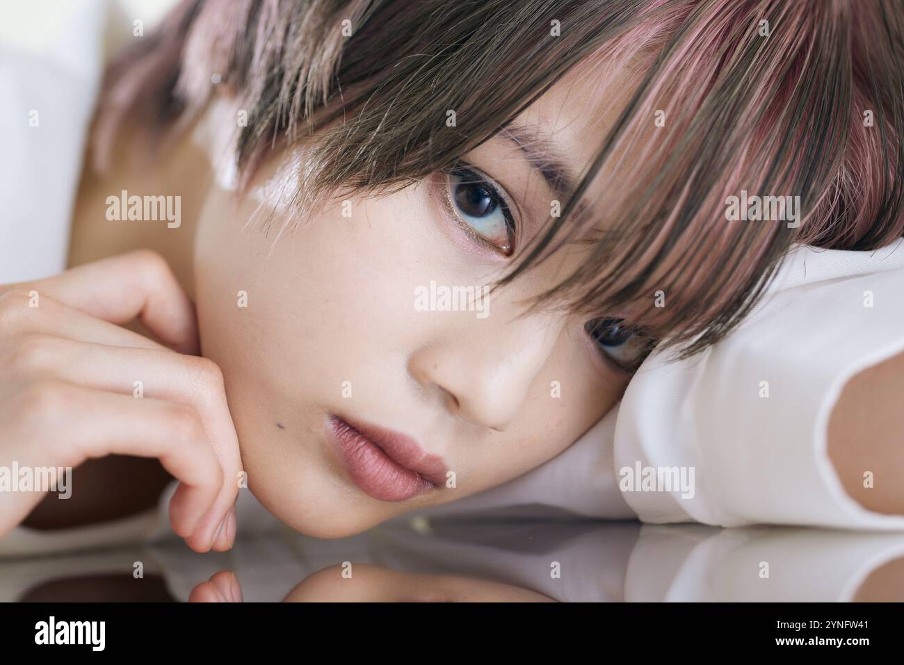 Japanese woman laying on Table Stock Photo - Alamy