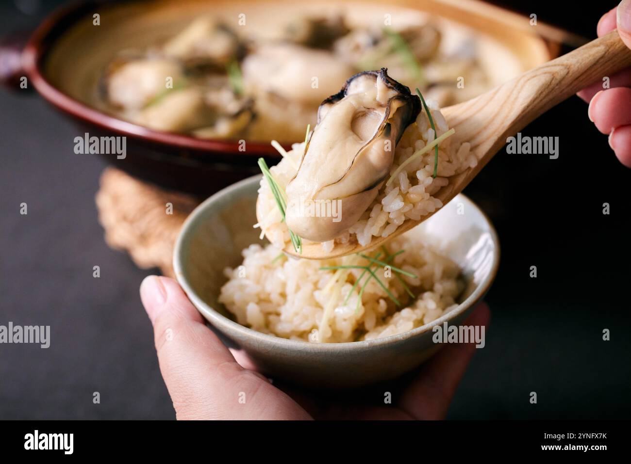 Bowl of rice with oysters and herbs Stock Photo - Alamy