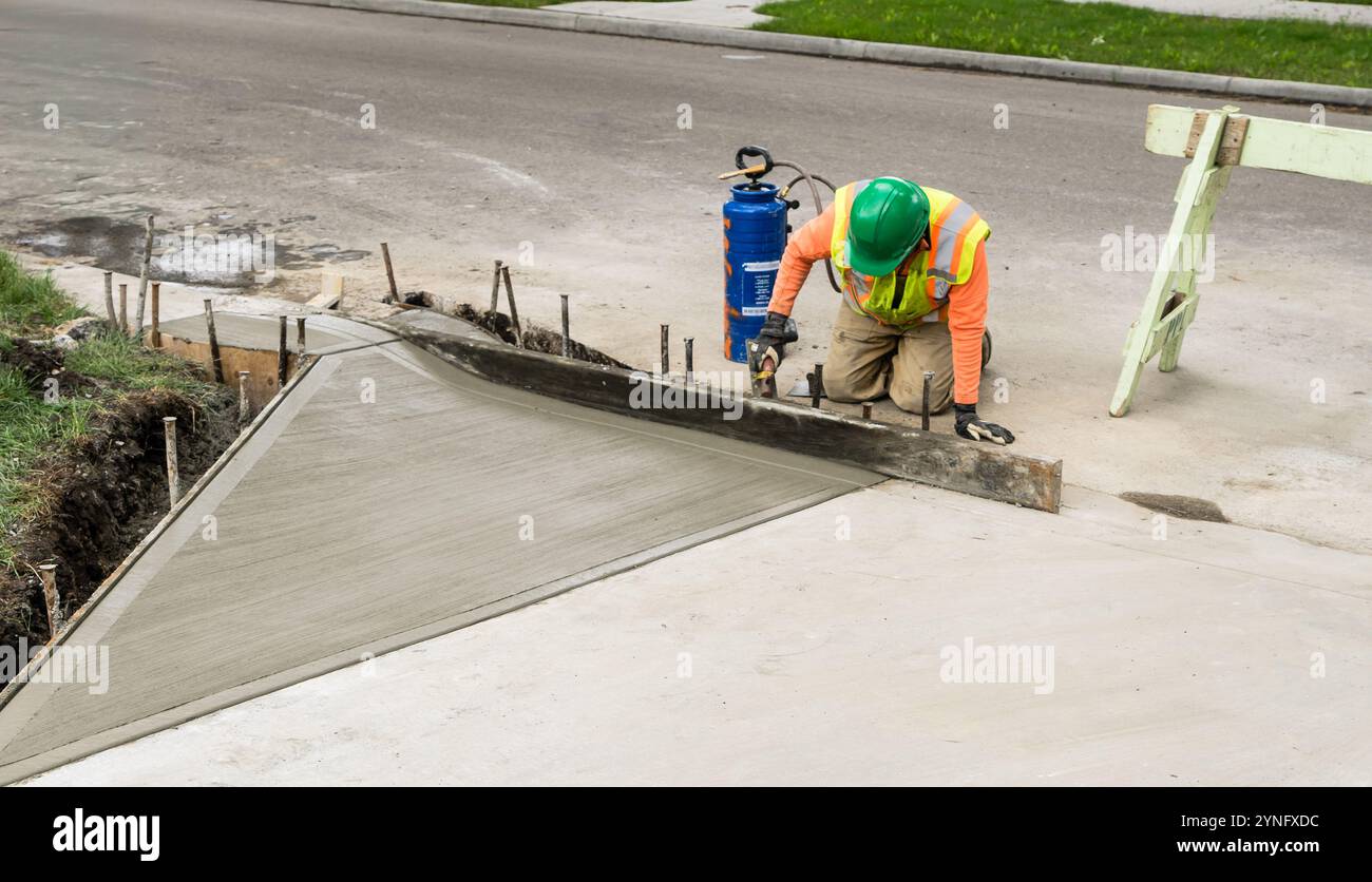 Edmonton, Canada, June 11, 2019: a worker finishing concrete job for ...