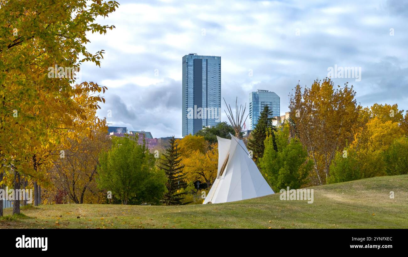 City of Edmonton park with tipi contrasted with skyscraper on ...