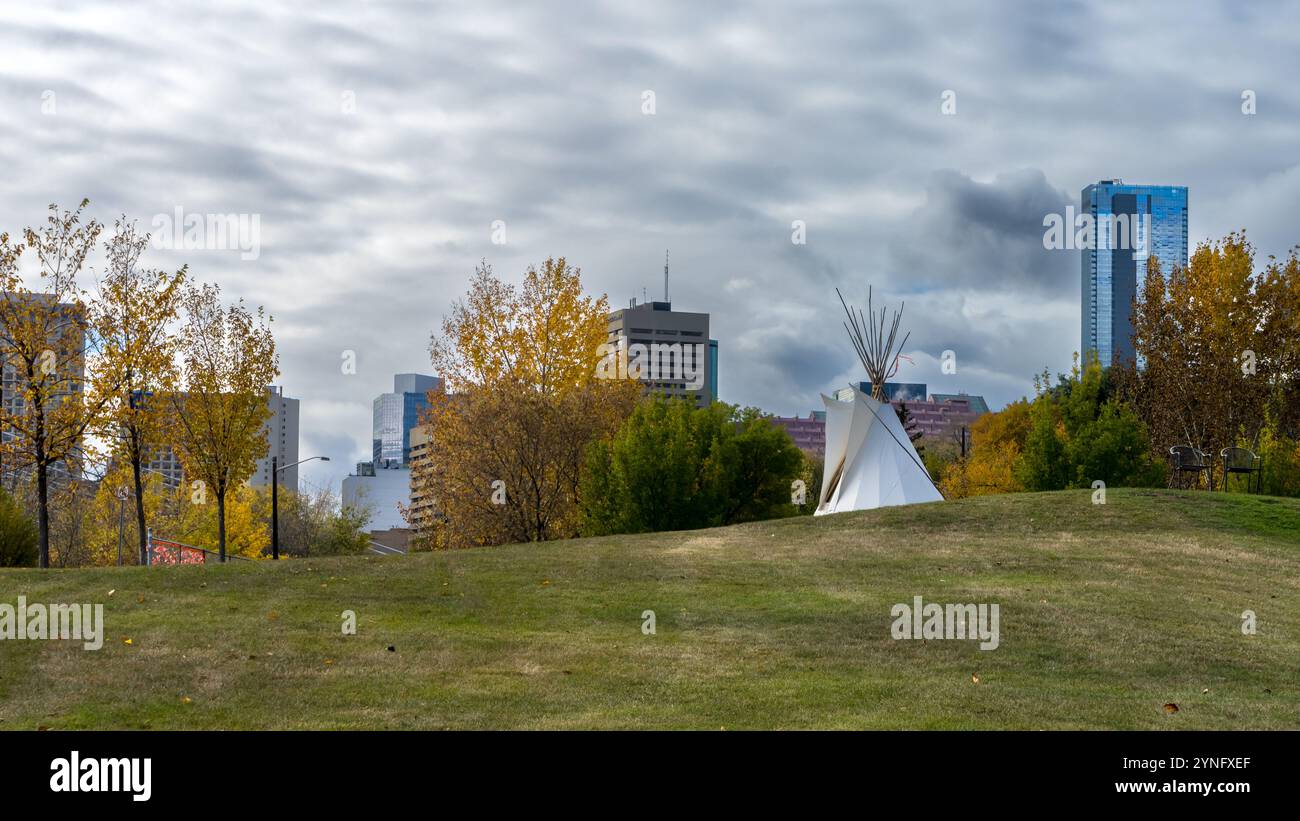 City of Edmonton park with tipi contrasted with skyscraper on ...