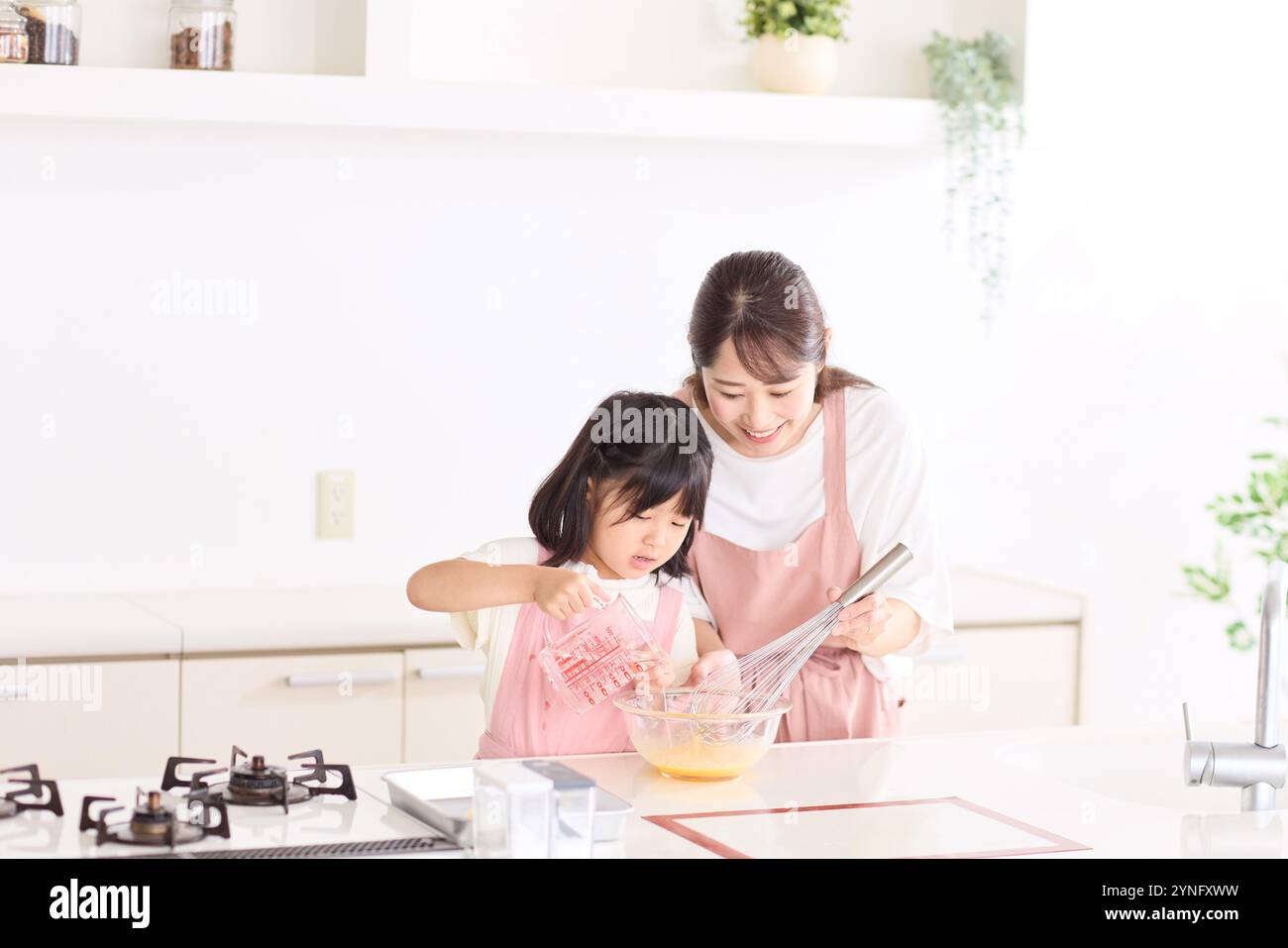 Japanese mother and daughter cooking together Stock Photo - Alamy