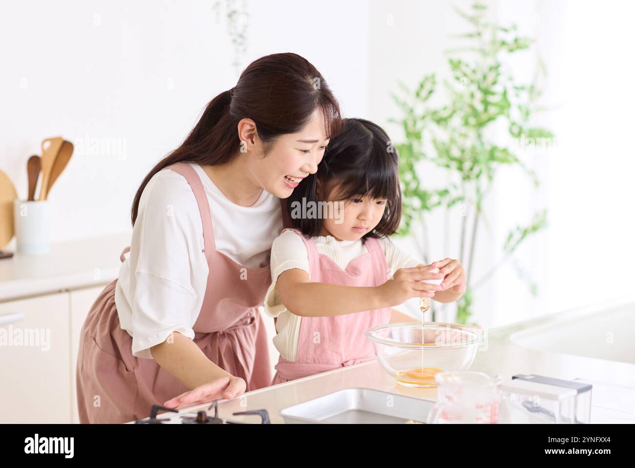 Japanese mother and daughter cooking together Stock Photo - Alamy