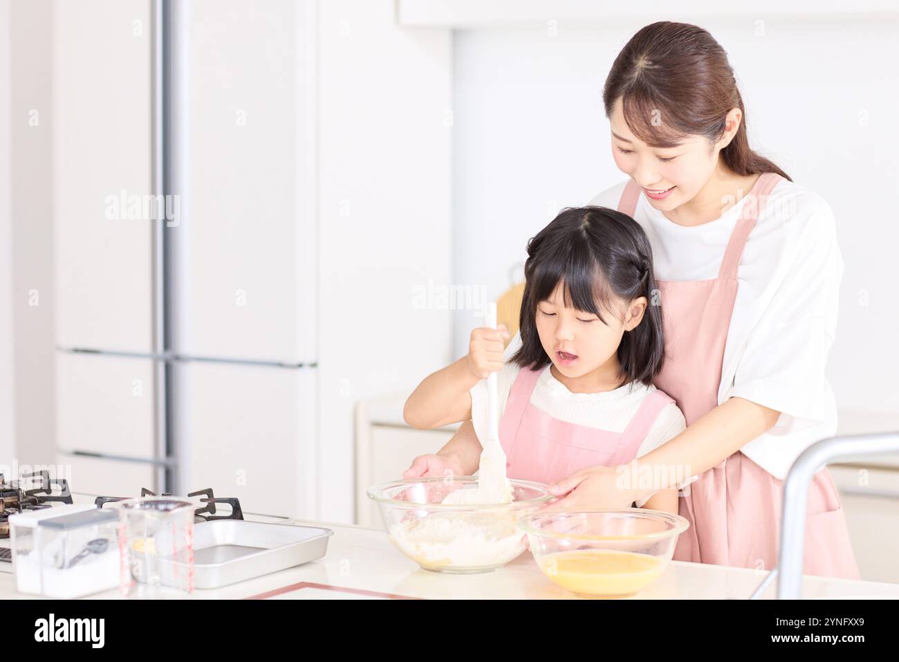 Japanese mother and daughter cooking together Stock Photo - Alamy