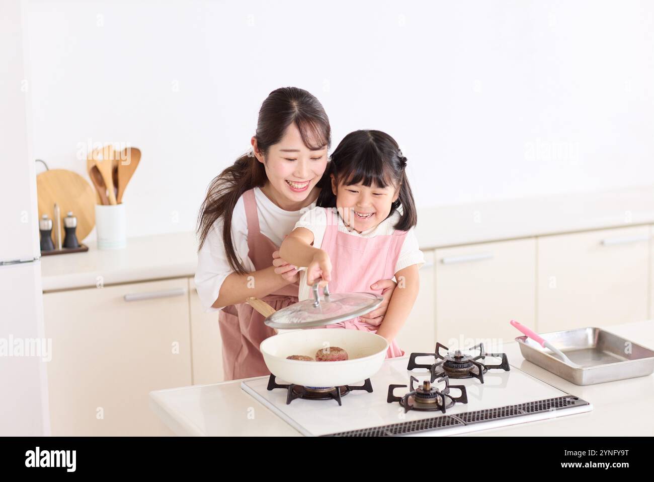 Japanese mother and daughter cooking together Stock Photo - Alamy