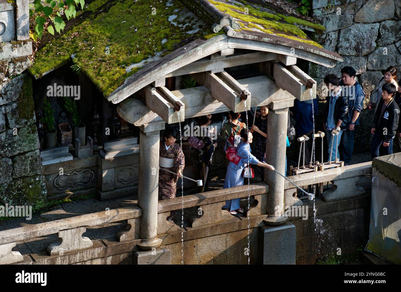 Visitors at Kiyomizu-dera Temple drink from the Otowanotaki (Sacred ...