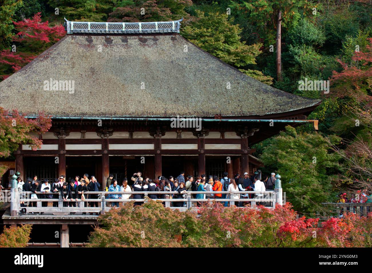 Tourists occupy the outdoor veranda of Okunoin Hall at Kyoto's famous ...
